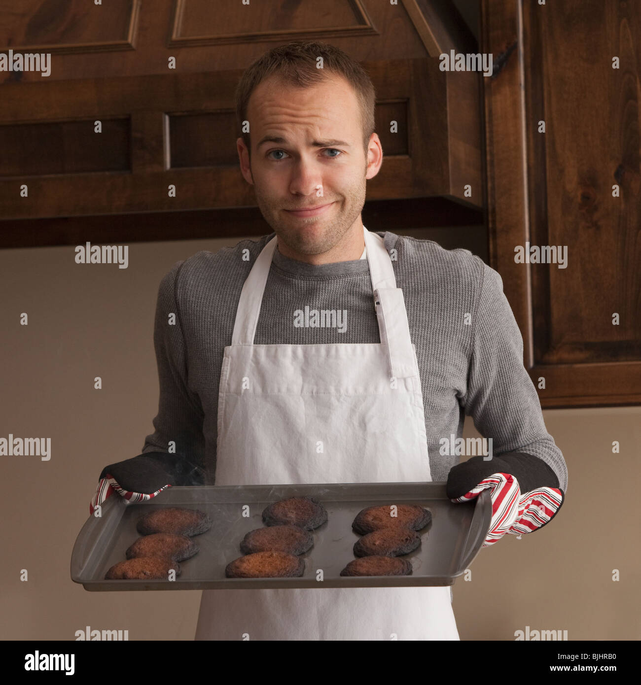 Man holding tray burnt cookies hi-res stock photography and images - Alamy Man holding tray burnt cookies hi-res stock photography and images - Alamy