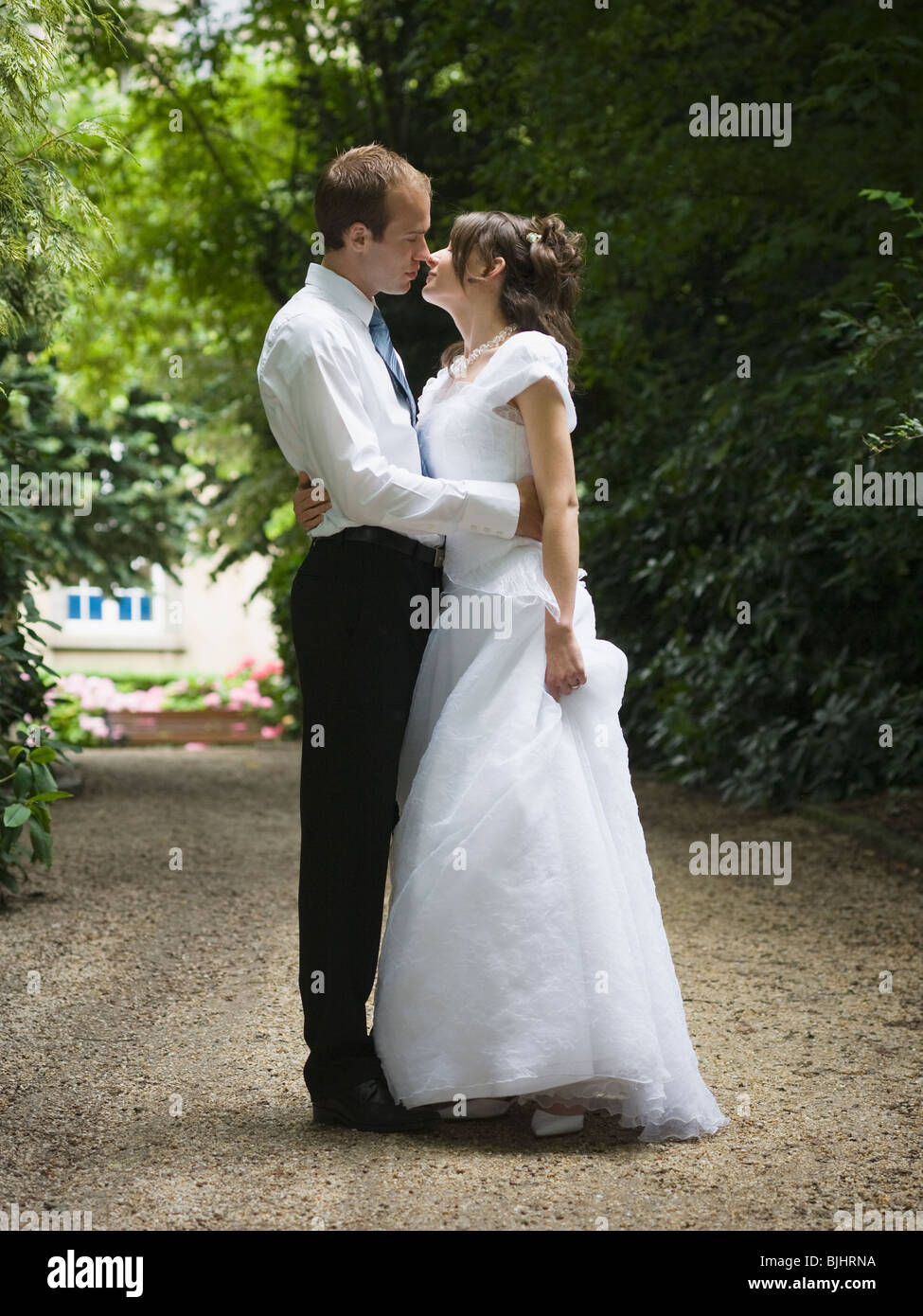 Bride and groom kissing Stock Photo - Alamy