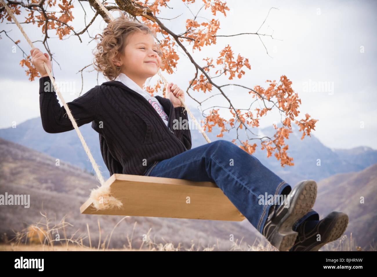 Child on swing Stock Photo - Alamy