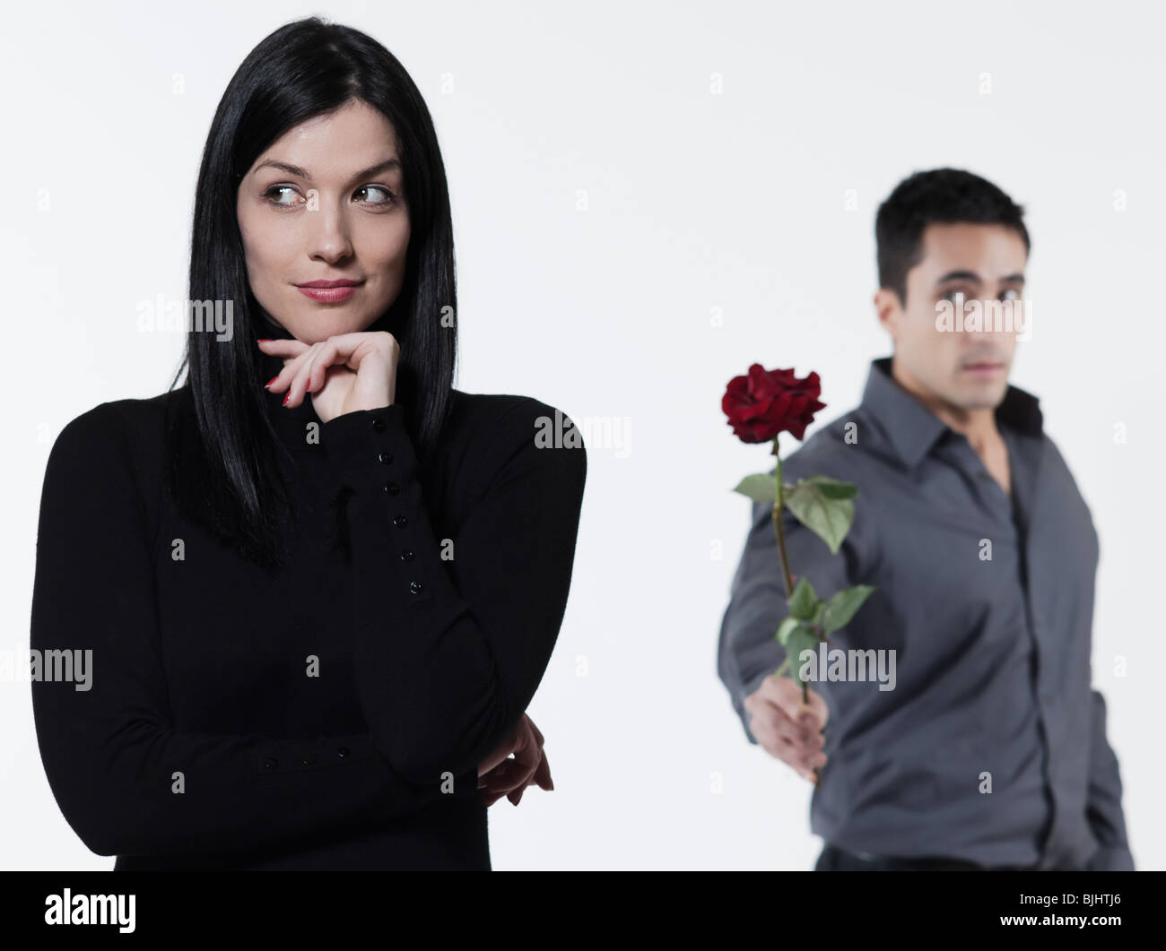 amn offering a rose to a woman Stock Photo - Alamy