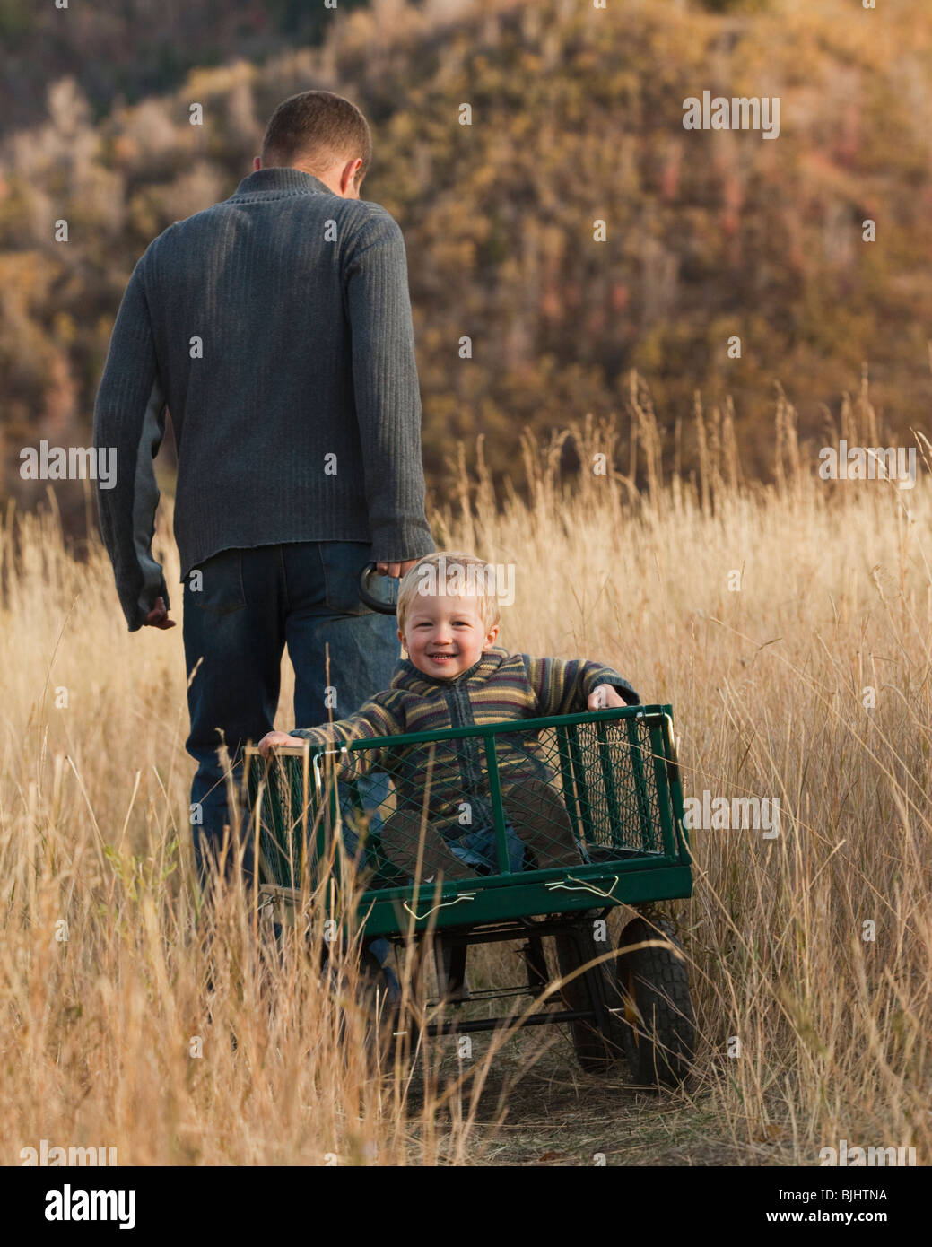 Man pulling wagon hi-res stock photography and images - Alamy