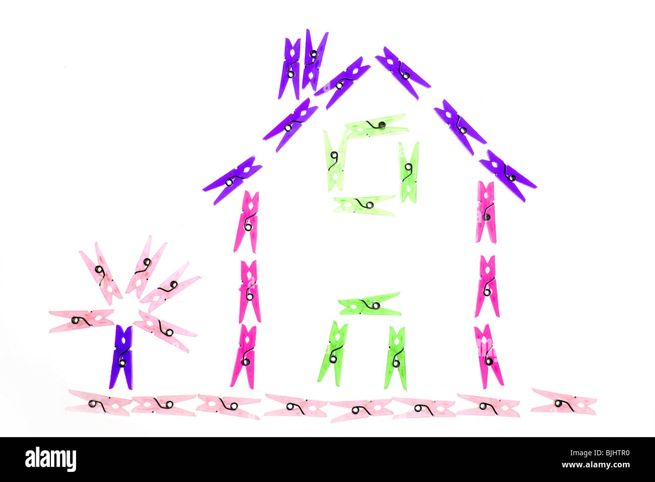 Mortgage metaphor, house shape made of colorful clothes pin Stock Photo ...