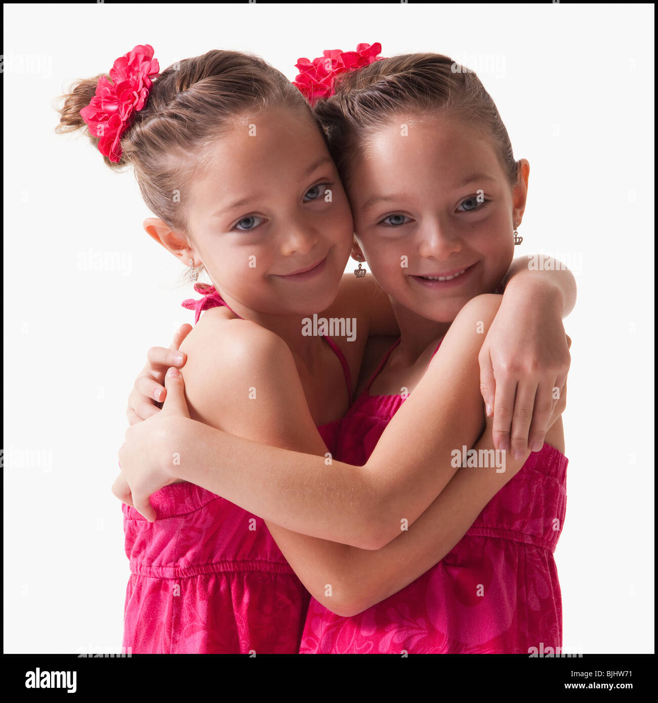 Twins embrace hi-res stock photography and images - Alamy
