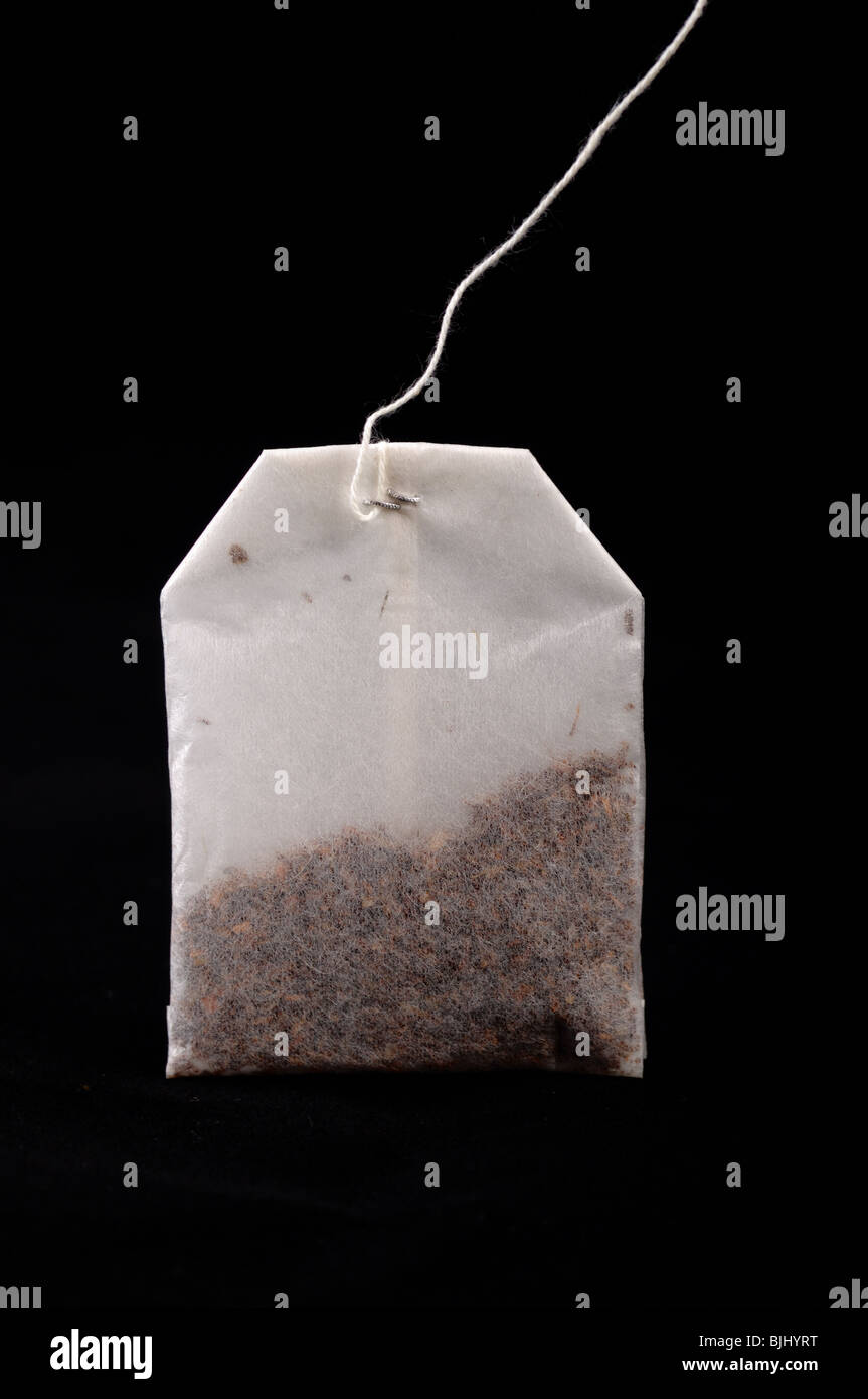 Tea bag on black background Stock Photo - Alamy