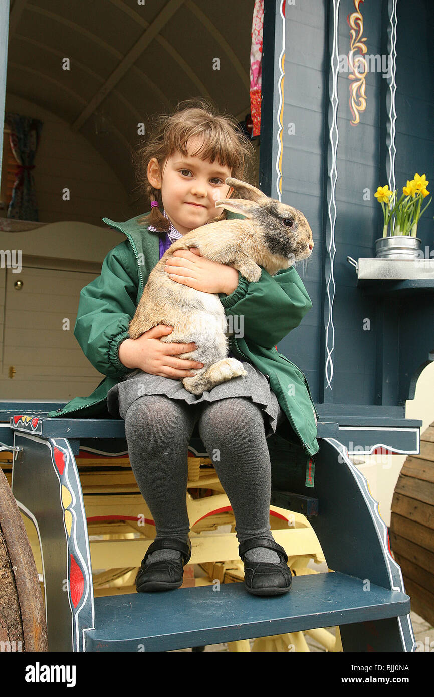 girl holding rabbit in Gypst Caravan Stock Photo - Alamy