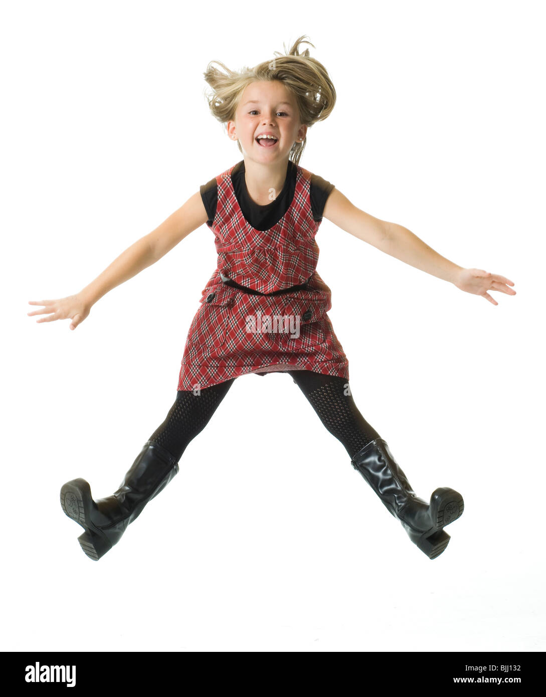 Girl smiling and leaping Stock Photo - Alamy