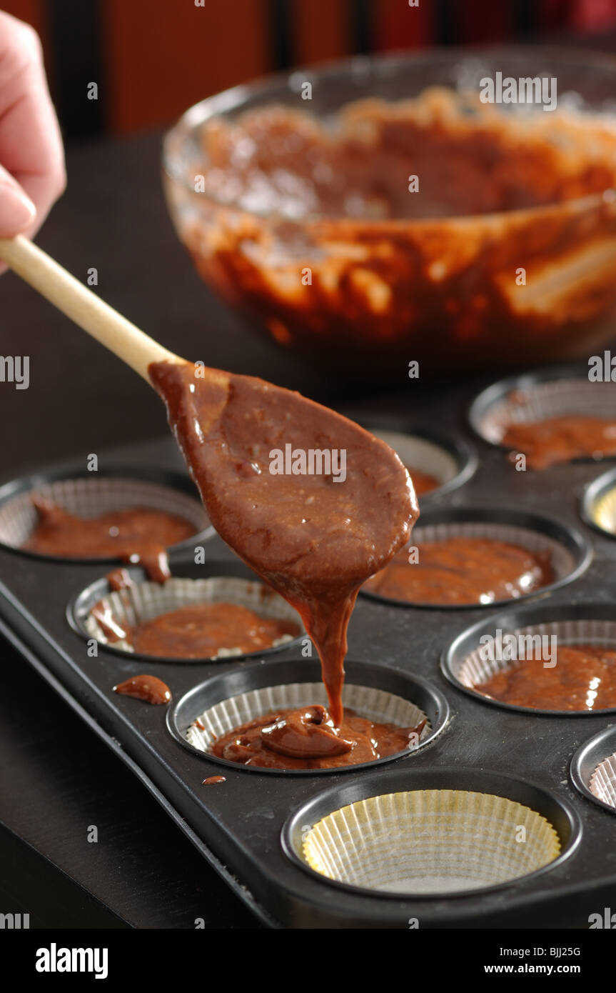 Preparing muffins at home for baking Stock Photo - Alamy