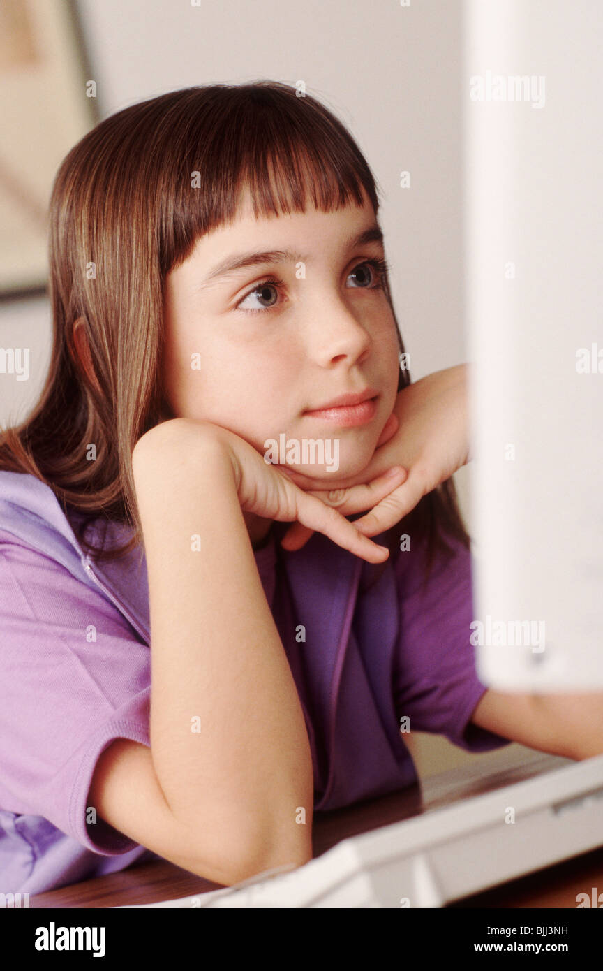 Child looking at computer Stock Photo - Alamy