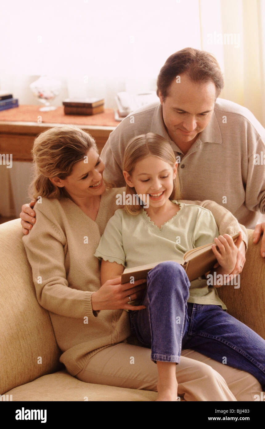 Family reading together Stock Photo - Alamy