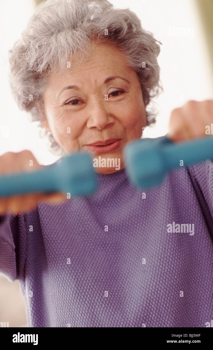 Old woman exercise free weights hi-res stock photography and images - Alamy