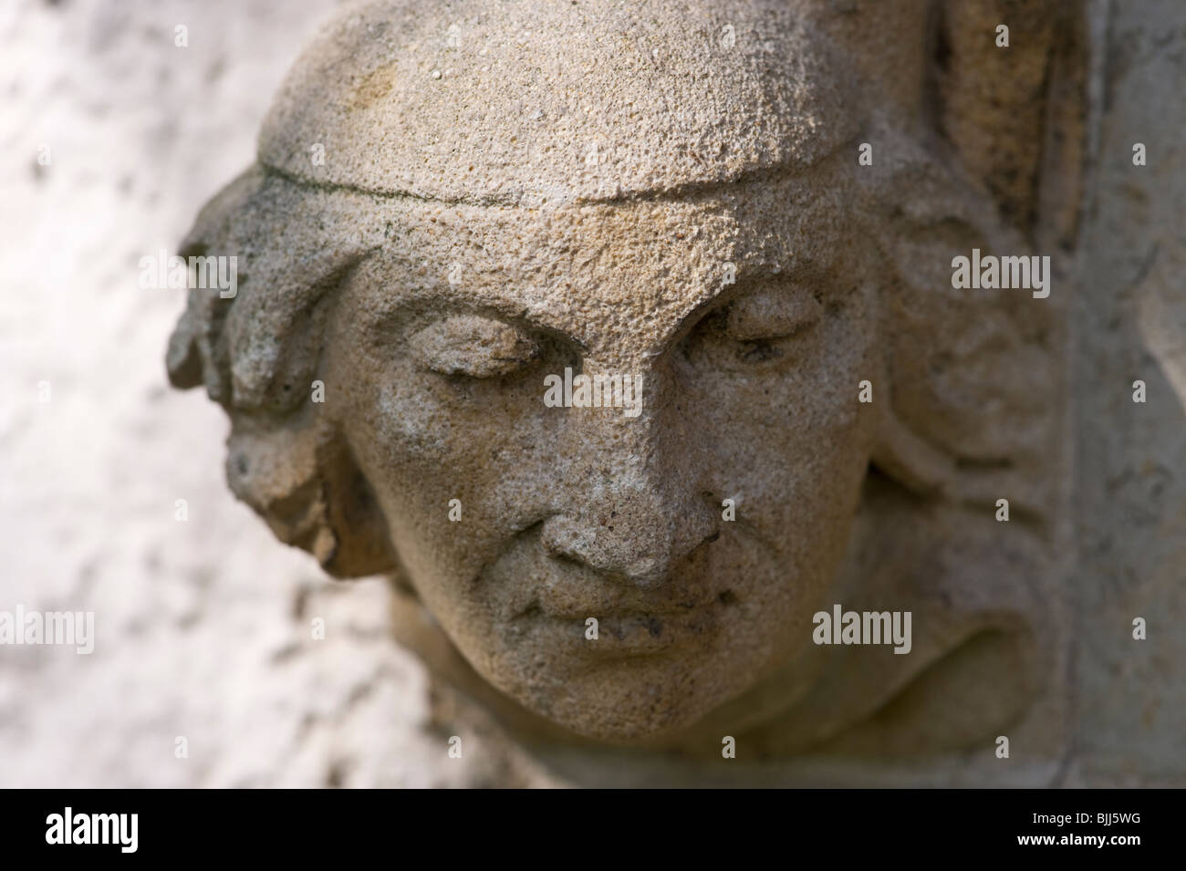exterior church wall detail a stone face outside St Mary the Virgin ...