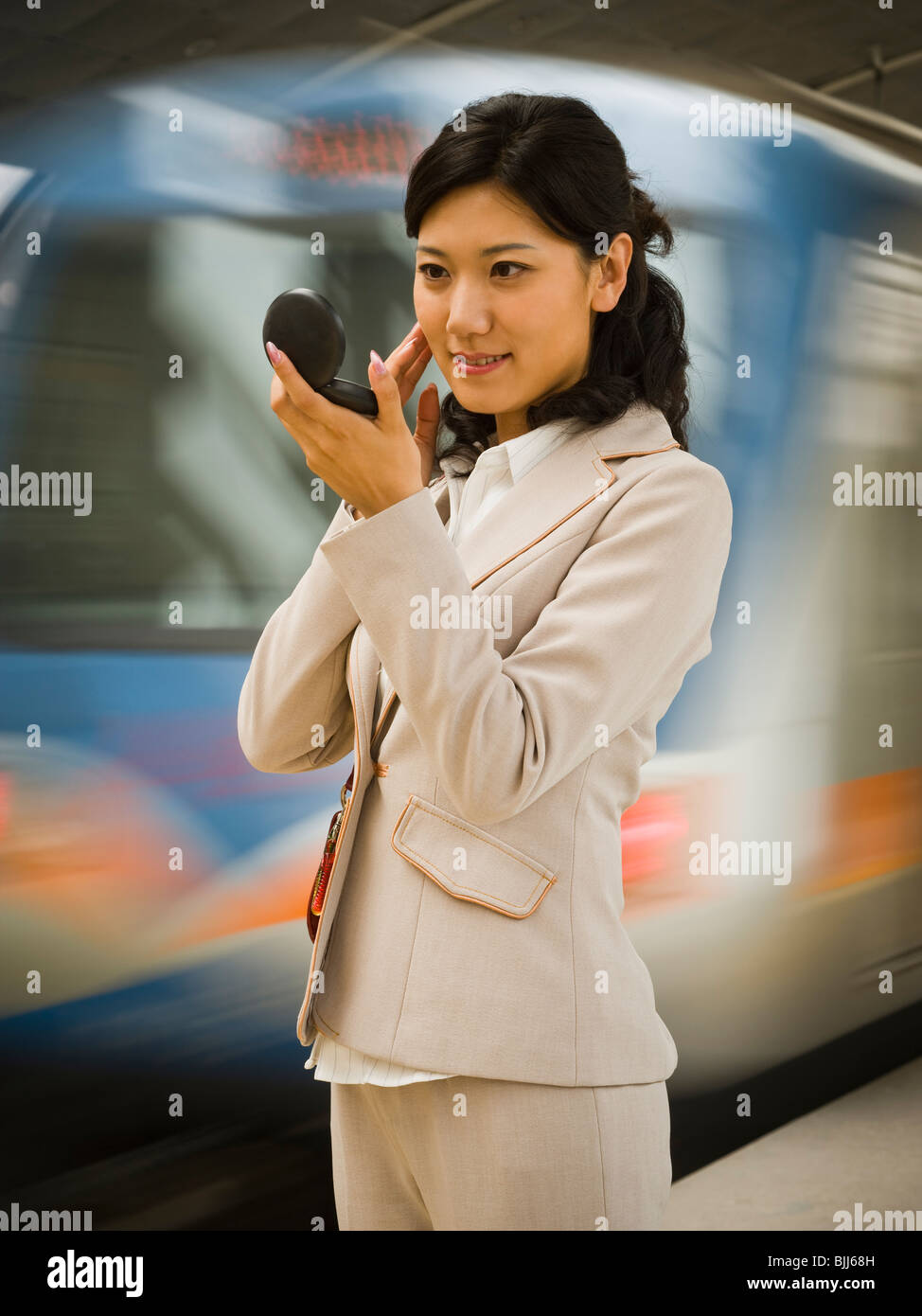 Female executive in subway train hi-res stock photography and images ...