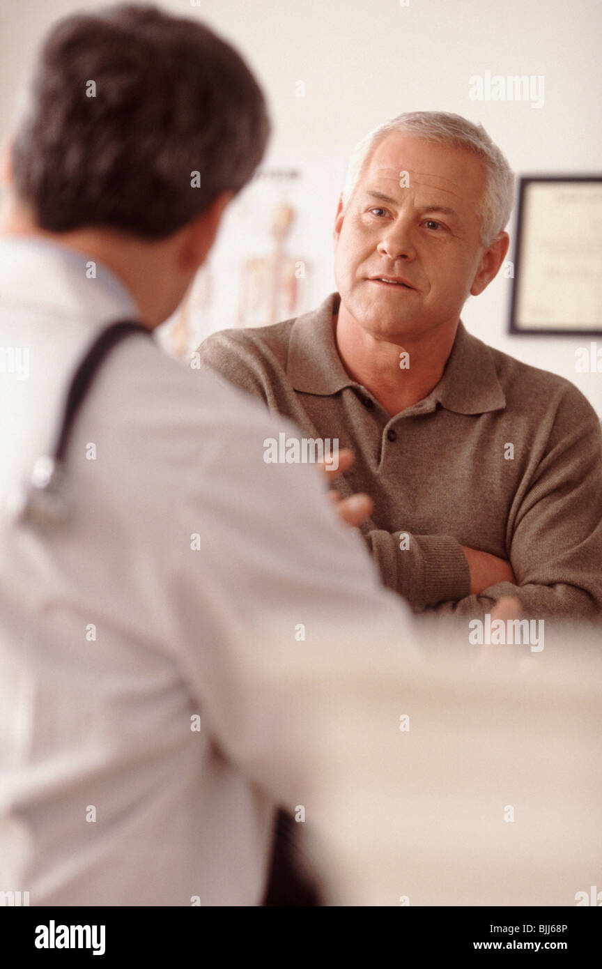Doctor talking to patient Stock Photo - Alamy