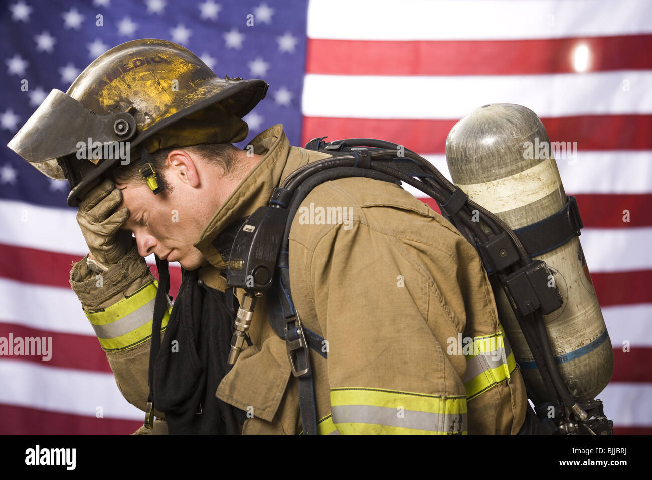 Portrait of a firefighter with US flag Stock Photo - Alamy