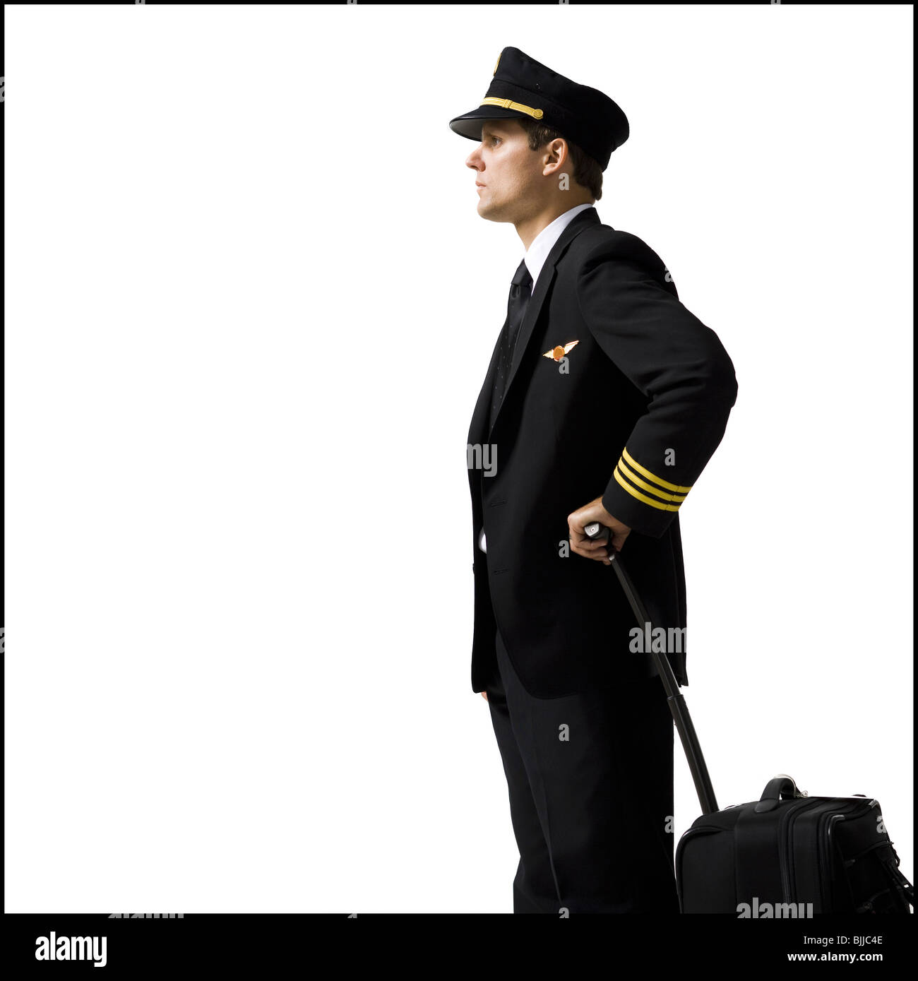 Profile of male pilot with luggage Stock Photo - Alamy