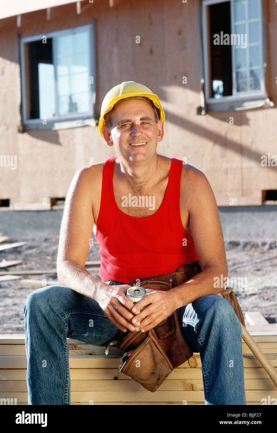 Blue Collar worker(, tradesman,) on break at construction site Stock ...