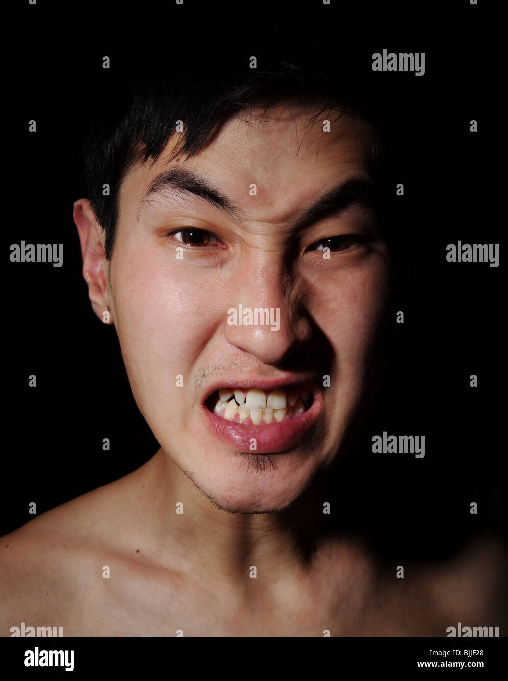 Obverse portrait of the Asian man, aggression, rage, emotions Stock ...