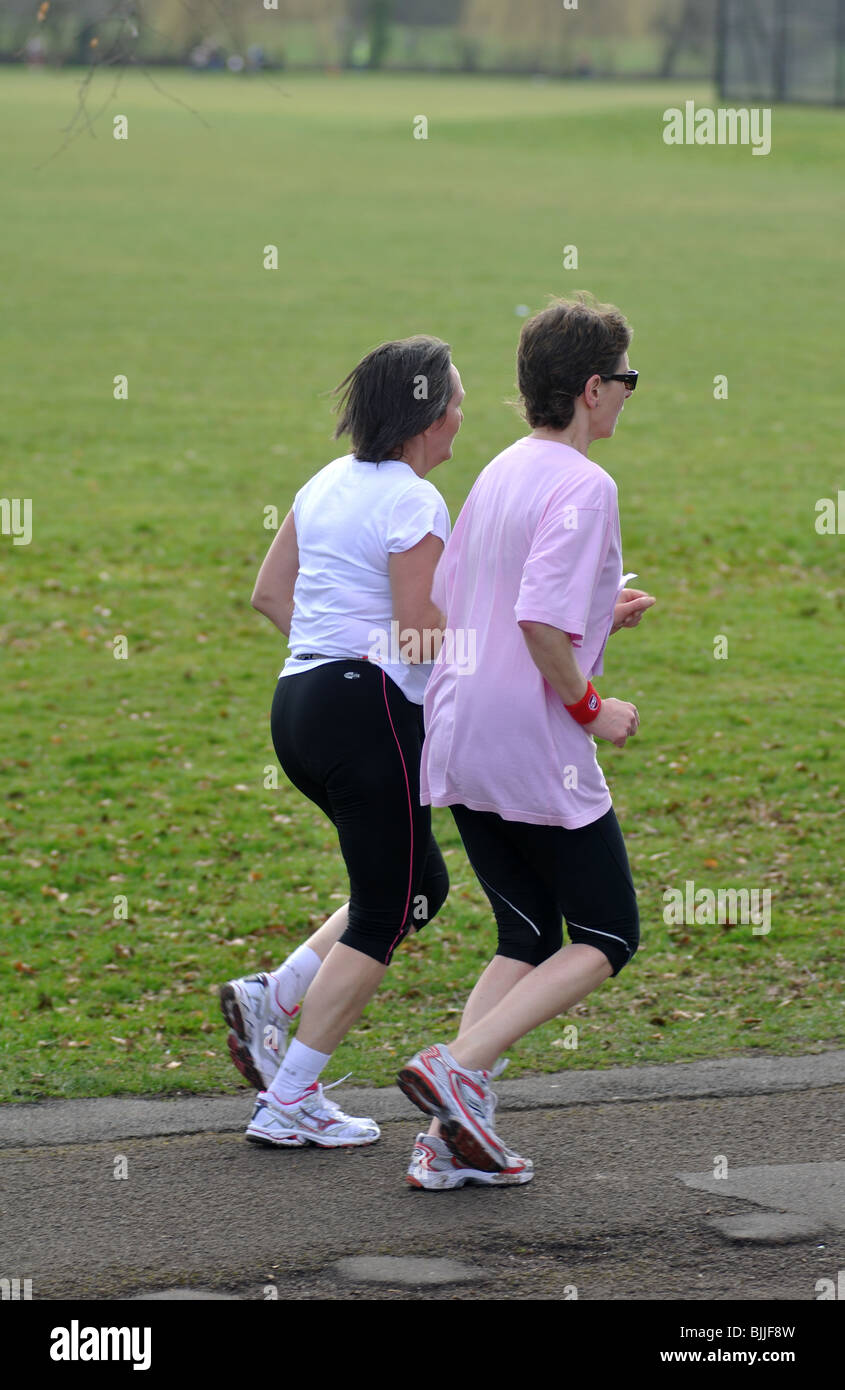 Two women runners in the Sport Relief Mile, Warwick, UK Stock Photo - Alamy