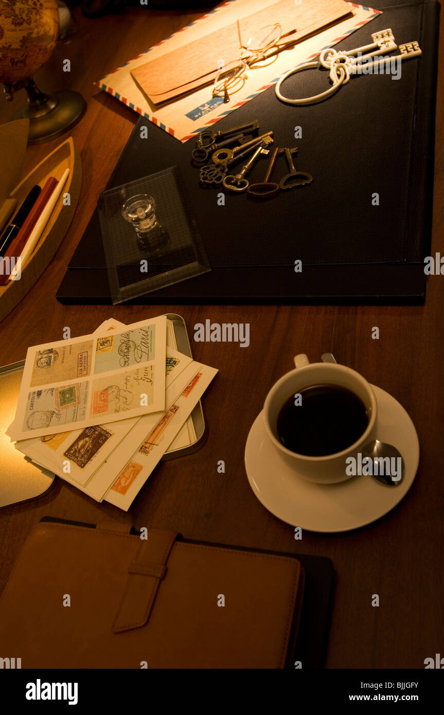 Coffee cup on desk with keys postage stamps and air mail Stock Photo ...