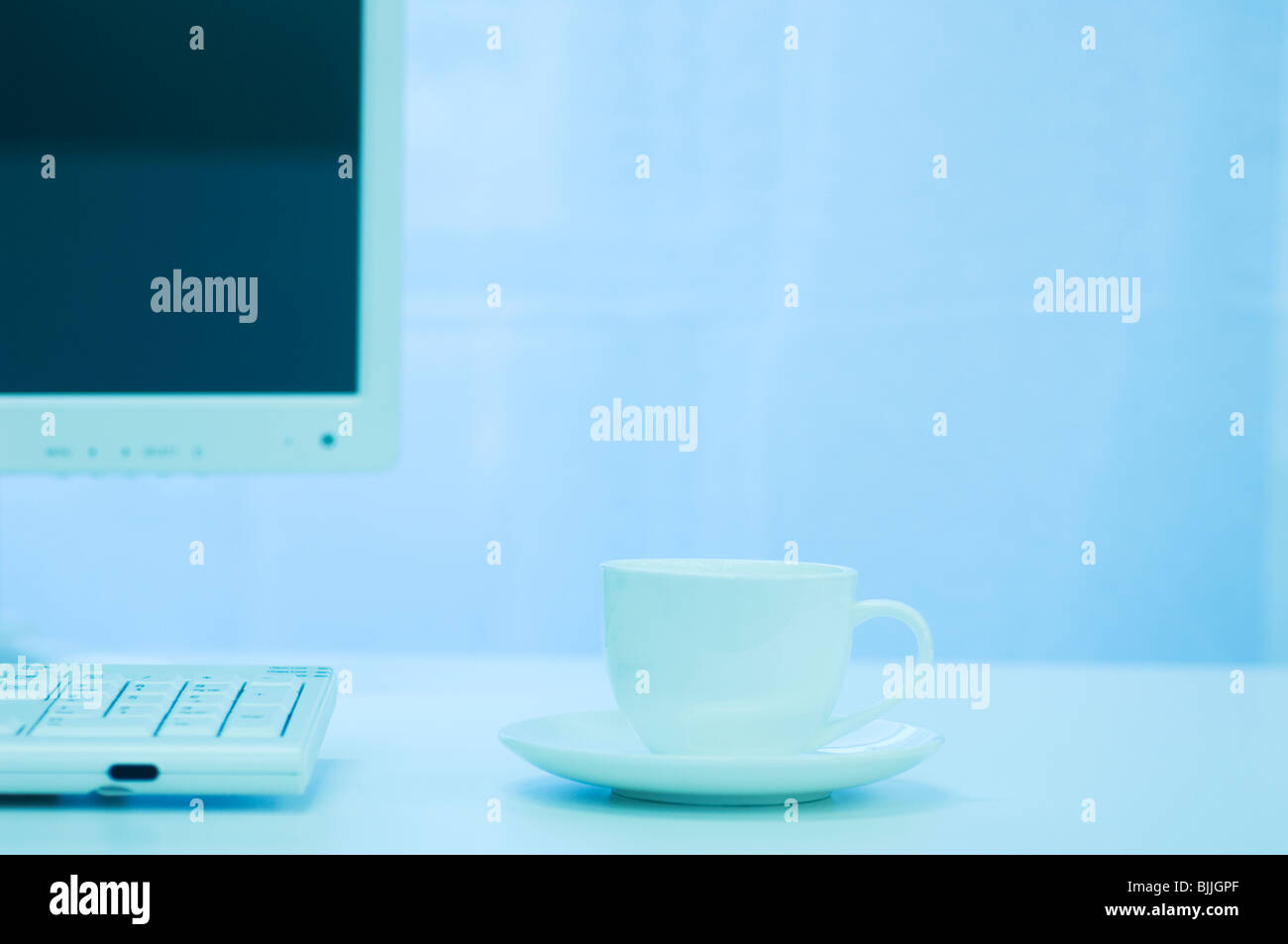 Desktop PC and coffee cup Stock Photo - Alamy