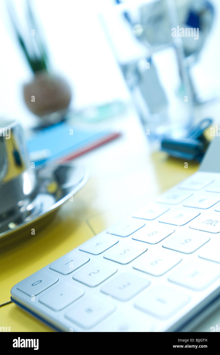 Calculator on office desk Stock Photo - Alamy