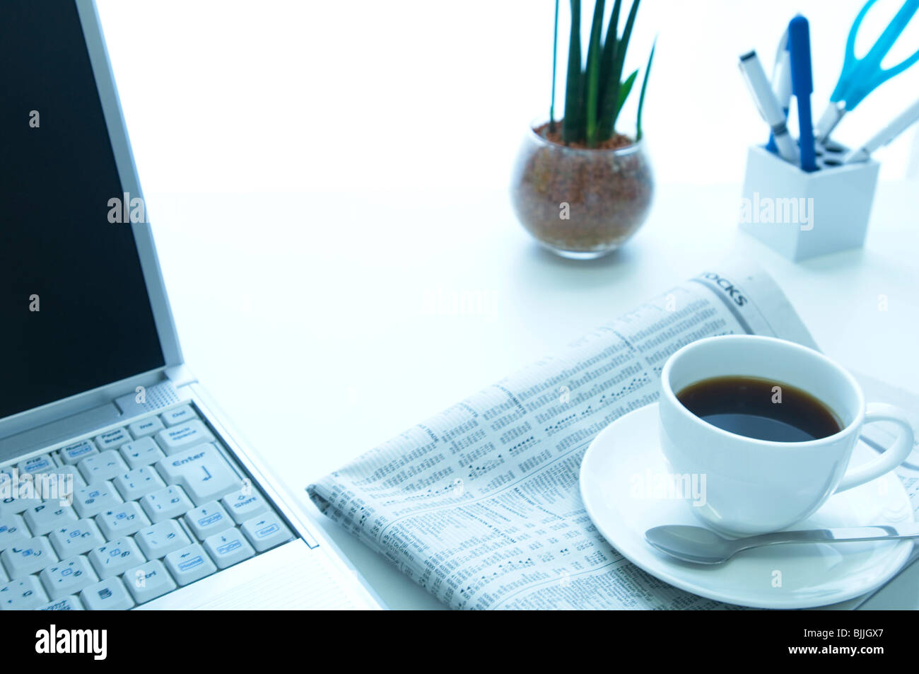 Coffee and newspaper on desk Stock Photo - Alamy