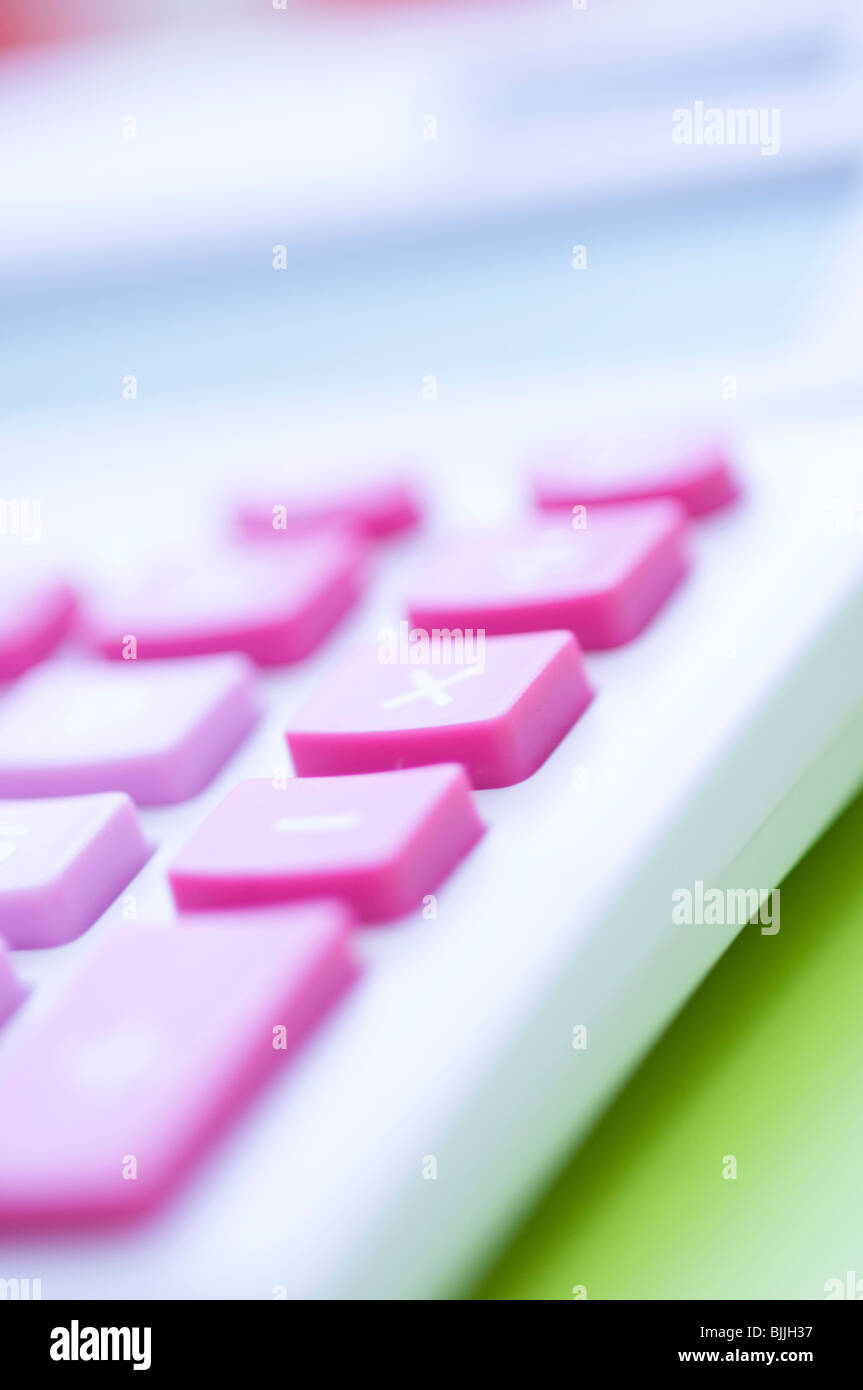 Pink calculator on desk Stock Photo - Alamy