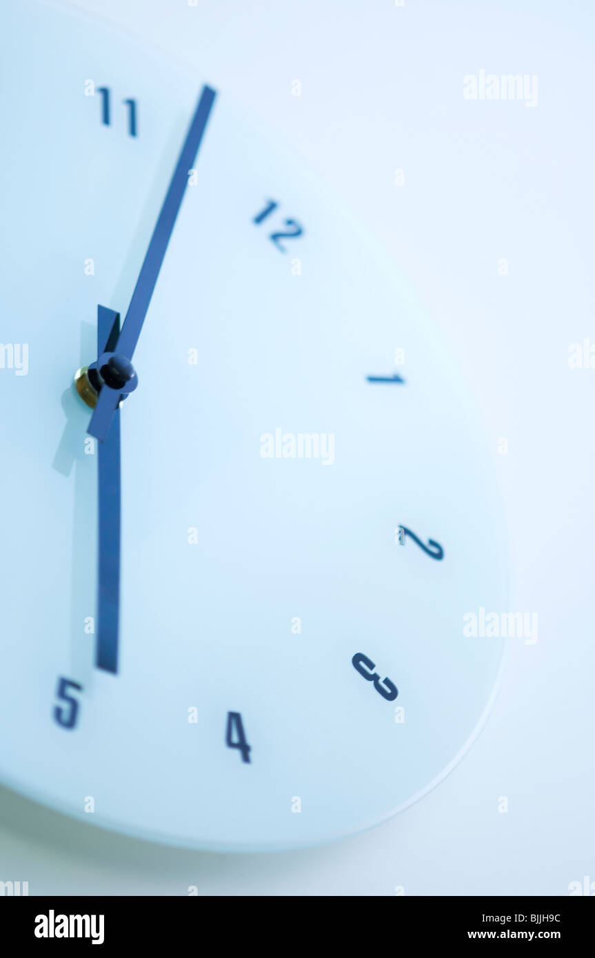 Clock reading 5:02 Stock Photo - Alamy