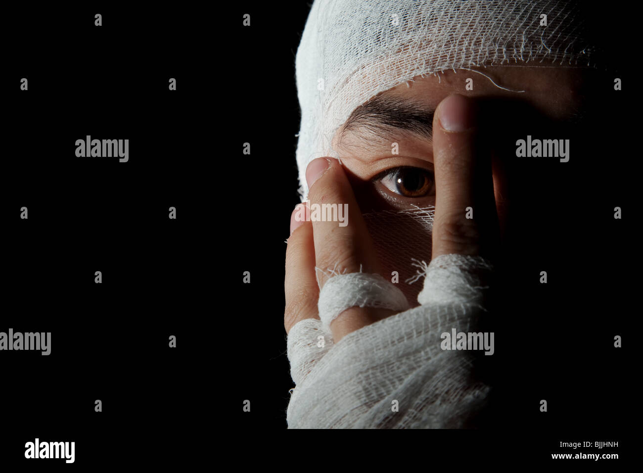 Obverse portrait of the young man which head is wound by bandage Stock ...