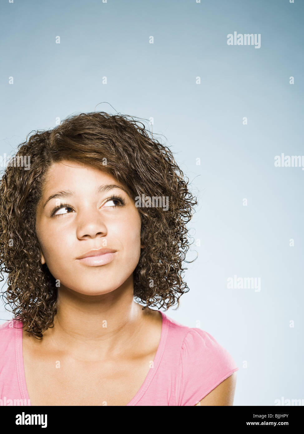 Closeup of girl thinking Stock Photo - Alamy