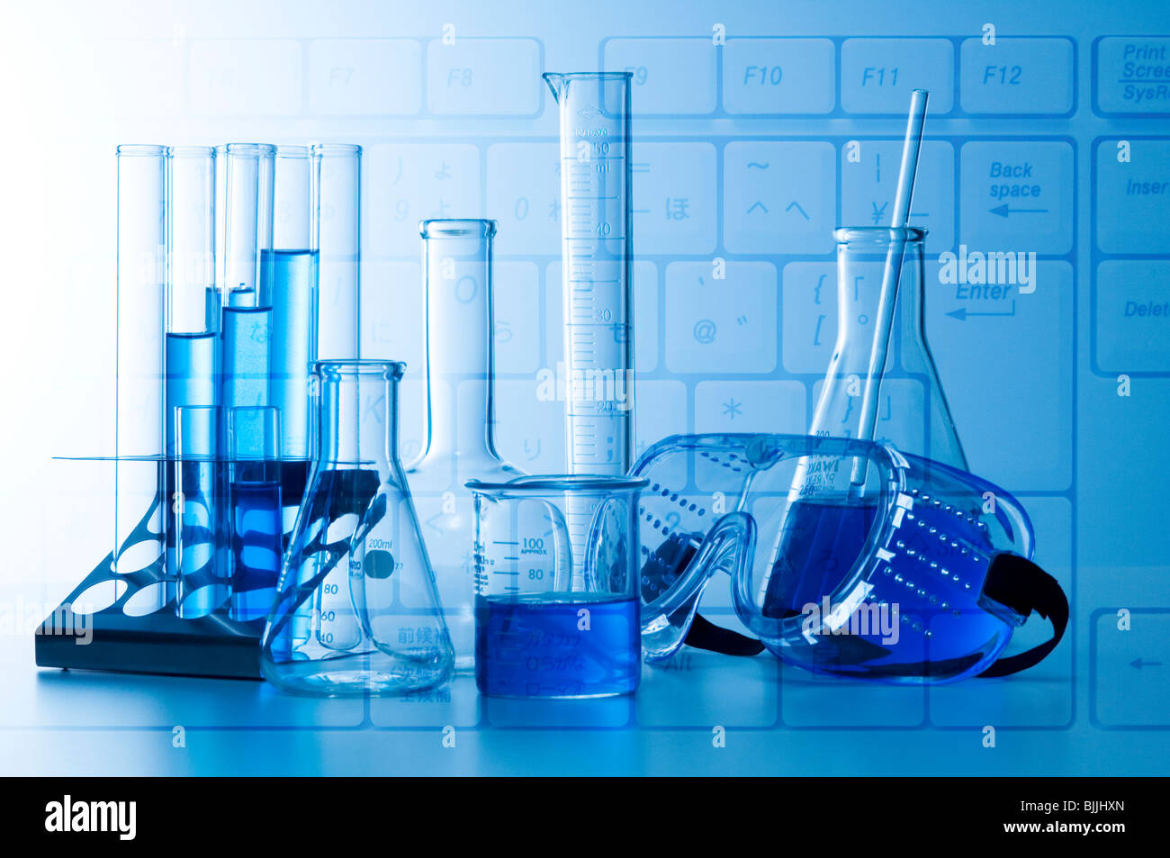 Laboratory equipment against computer keyboard Stock Photo - Alamy