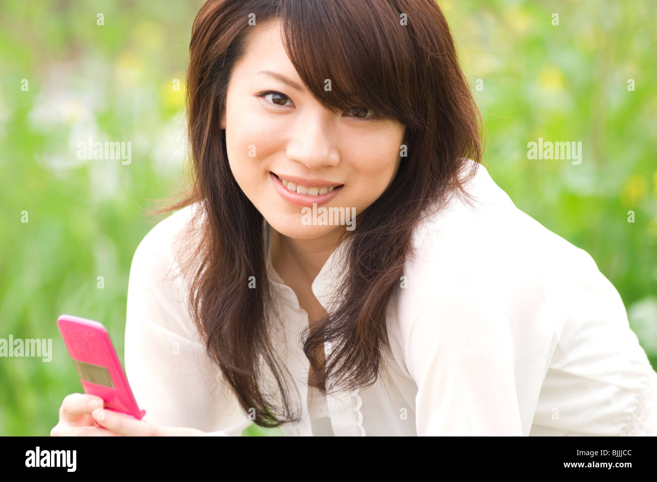Young japanese woman texting text hi-res stock photography and images ...