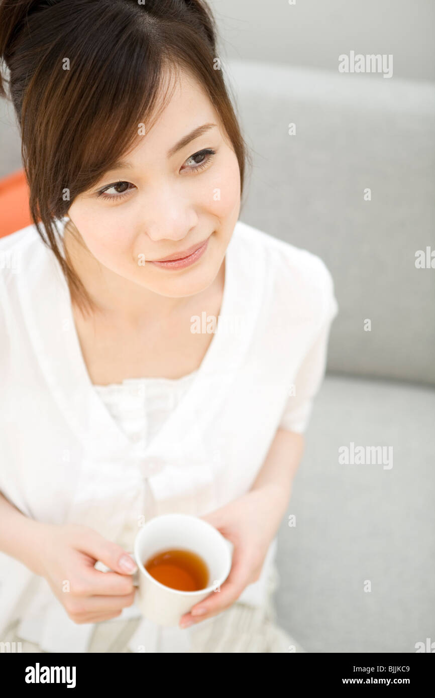 Asian woman drinking tea hi-res stock photography and images - Alamy