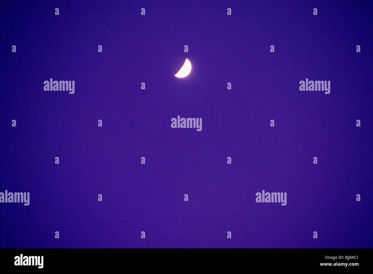 Crescent moon with purple sky Stock Photo - Alamy