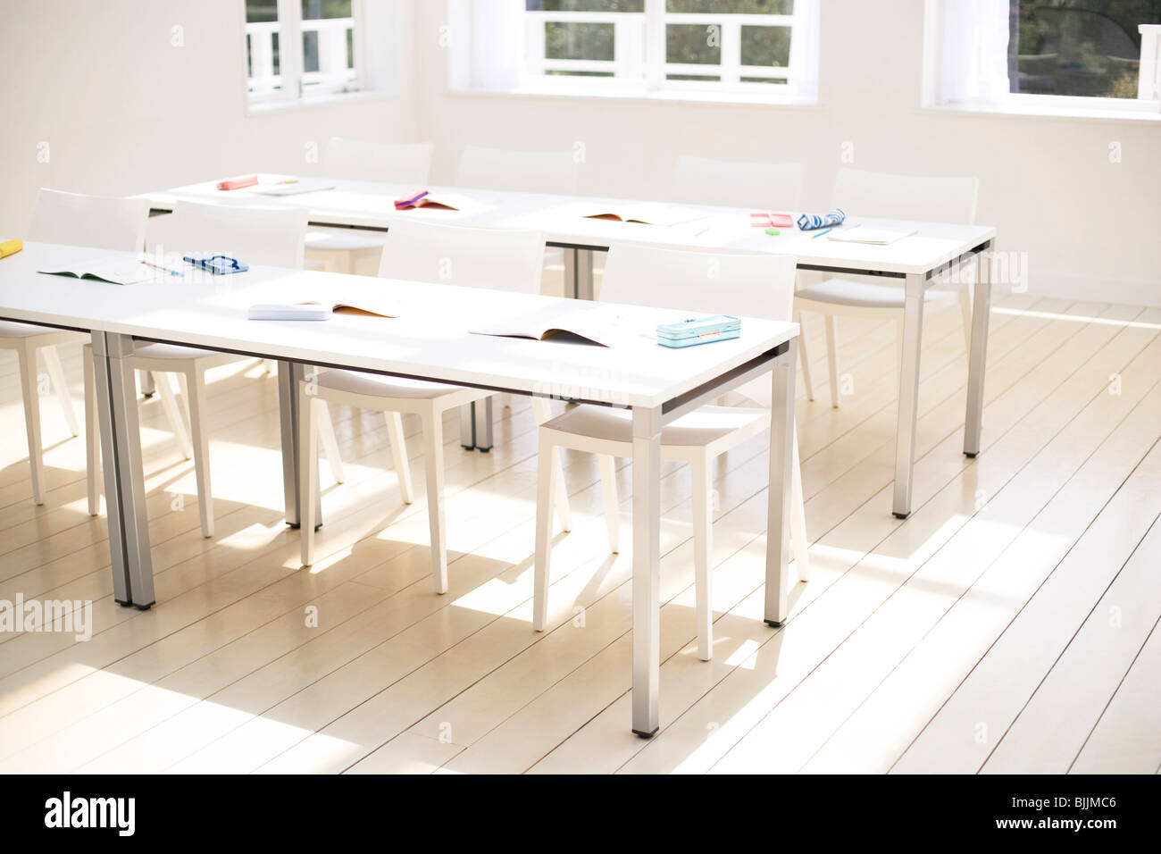 Books and stationery arranged in school classroom Stock Photo - Alamy