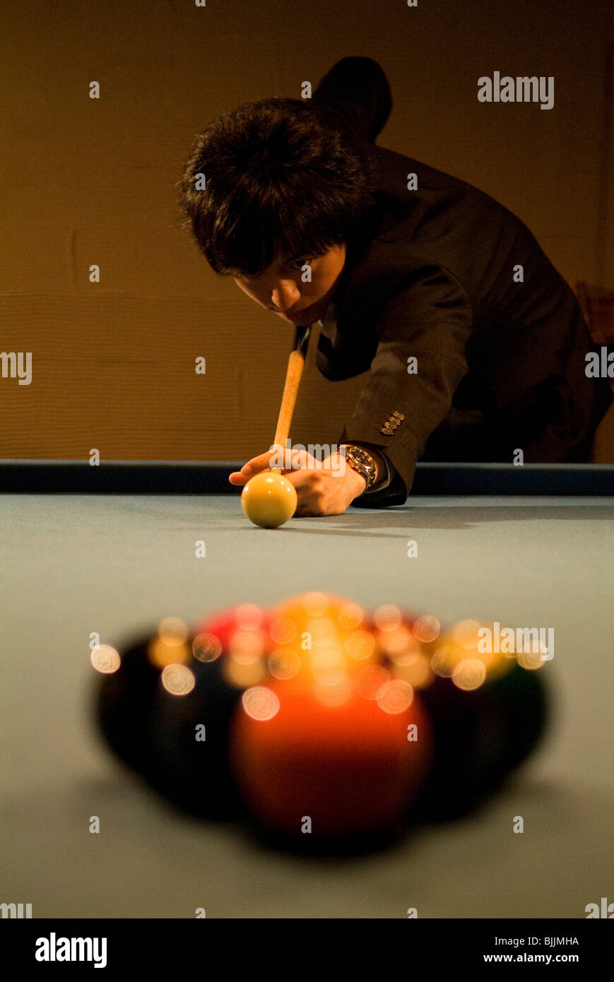 Businessman playing pool Stock Photo - Alamy