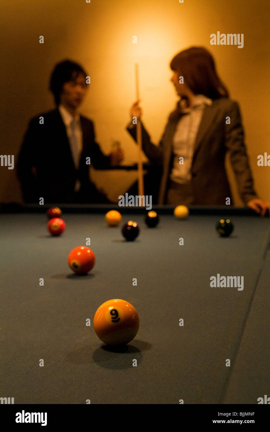 Business colleagues playing pool Stock Photo - Alamy
