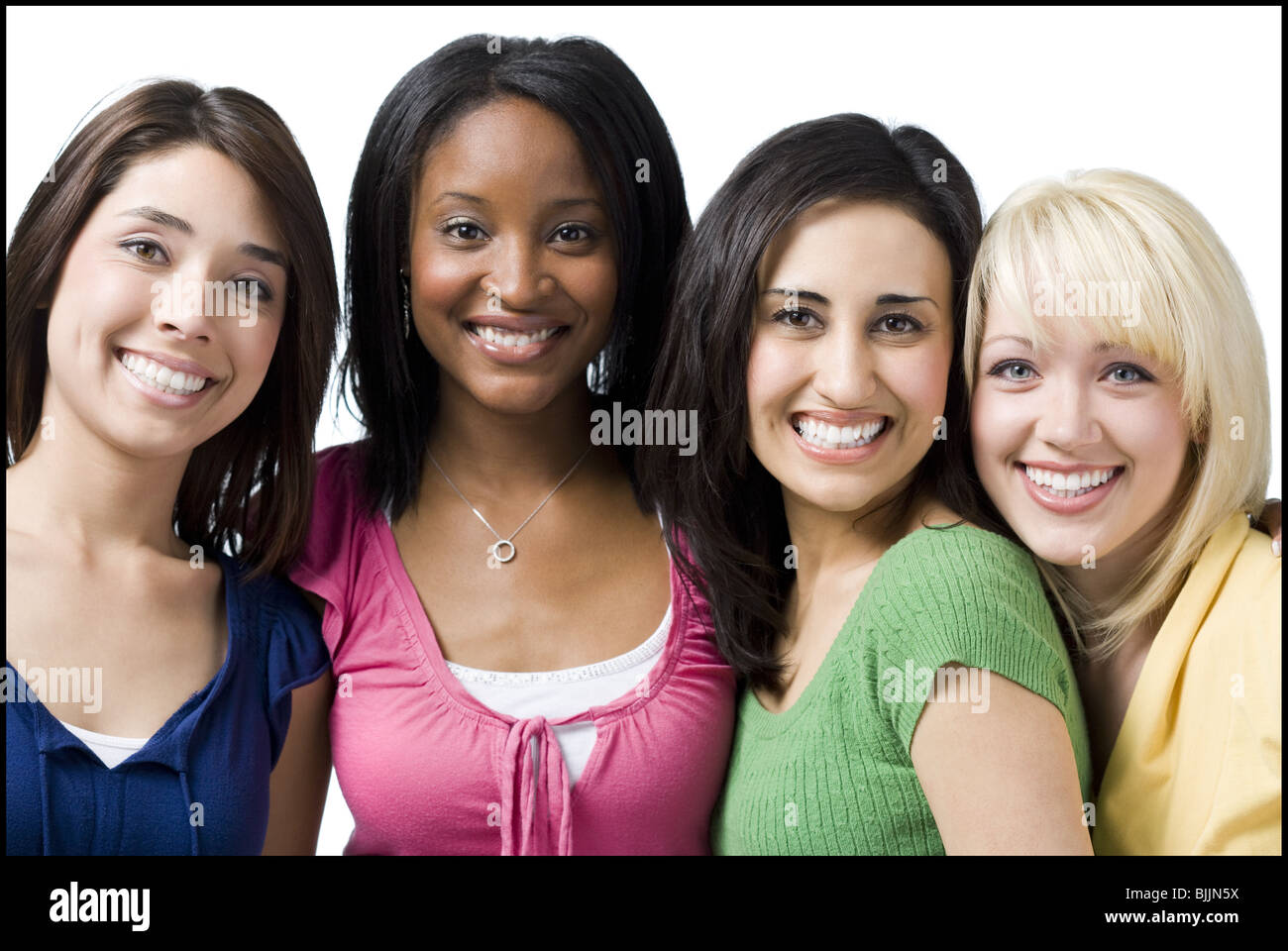 Four women hugging and smiling Stock Photo - Alamy