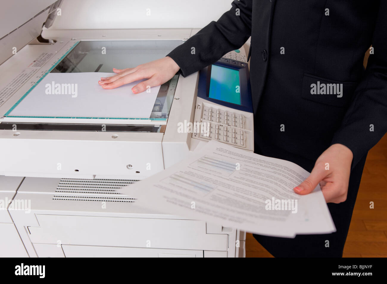 Hands of a businesswoman copying documents Stock Photo - Alamy