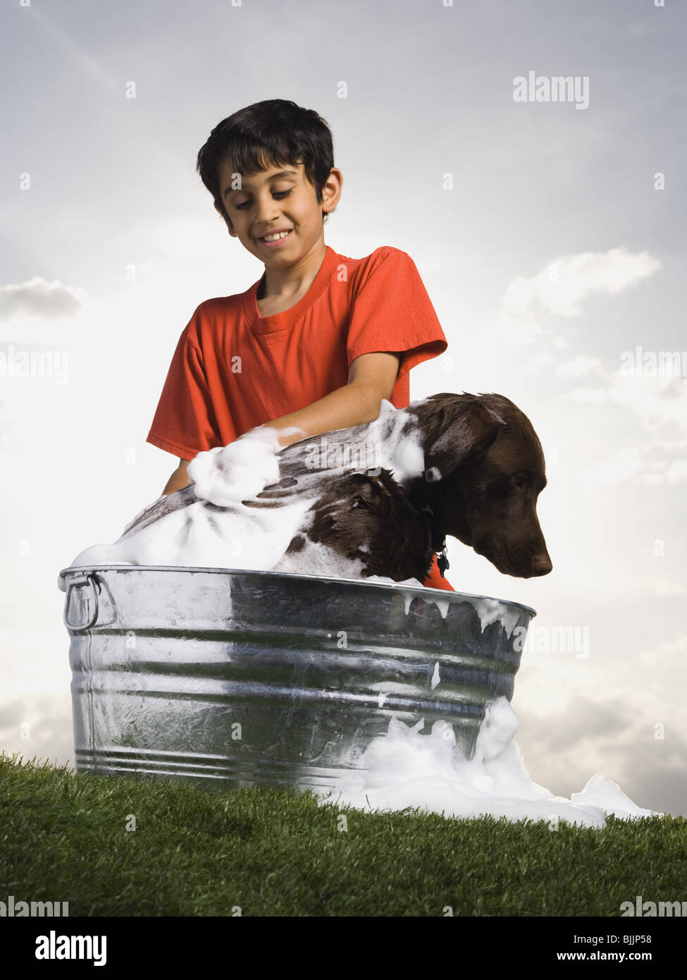 Child washing dog outside hi-res stock photography and images - Alamy
