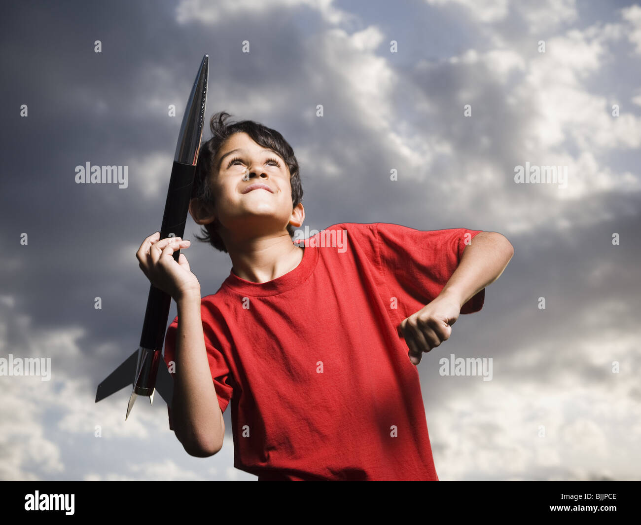Boy playing with toy rocket outdoors Stock Photo - Alamy