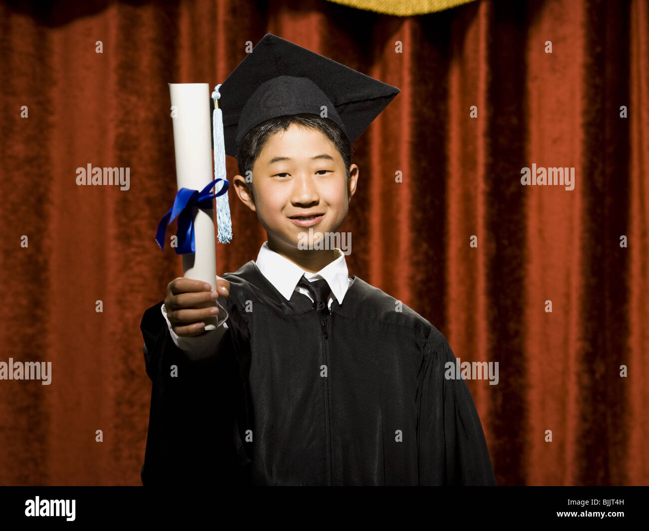 Boy graduate with mortar board and diploma smiling with braces Stock ...