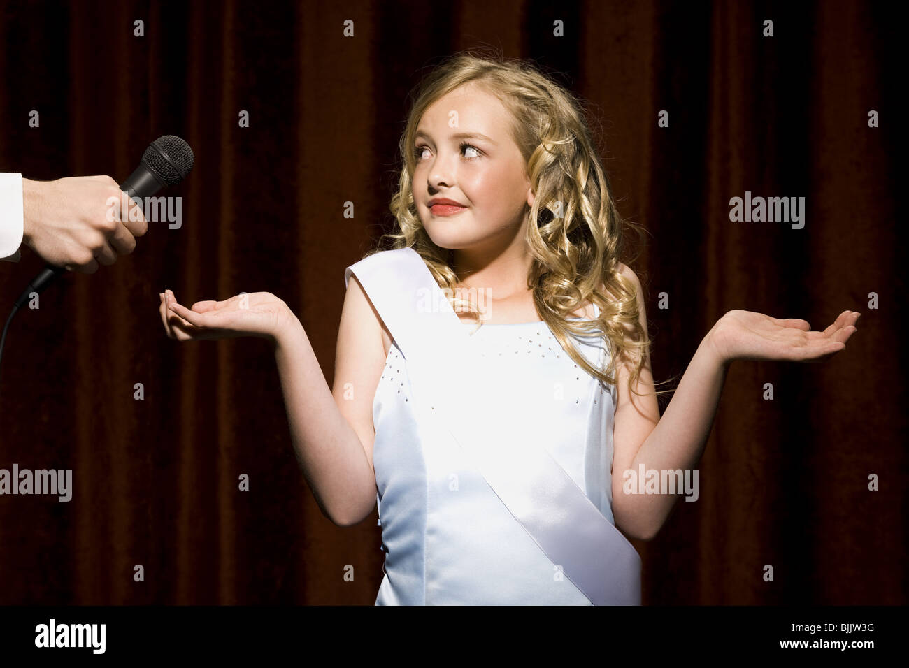Girl beauty pageant contestant with microphone looking nervous Stock ...