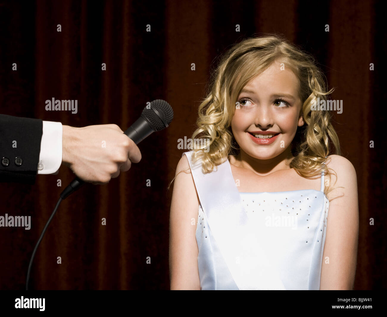 Girl beauty pageant contestant with microphone looking nervous Stock ...