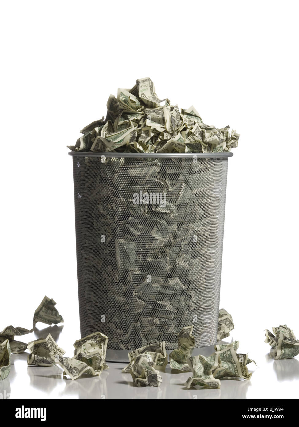 Waste paper basket with crumpled money Stock Photo - Alamy