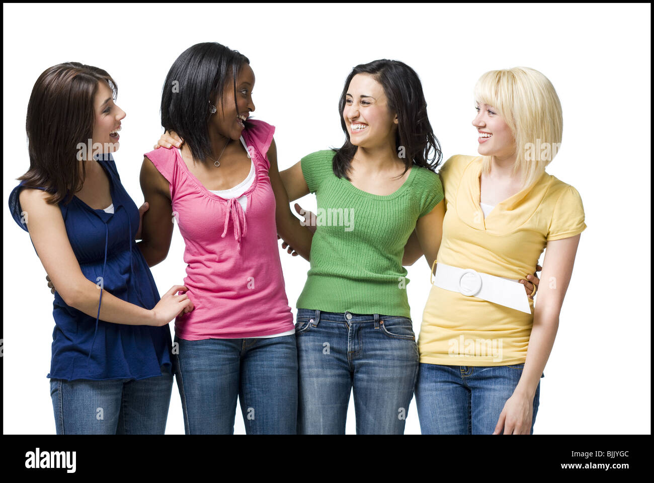 Four women hugging and smiling Stock Photo - Alamy