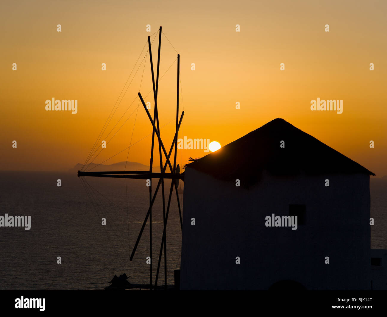 Building on water at sunset Stock Photo - Alamy