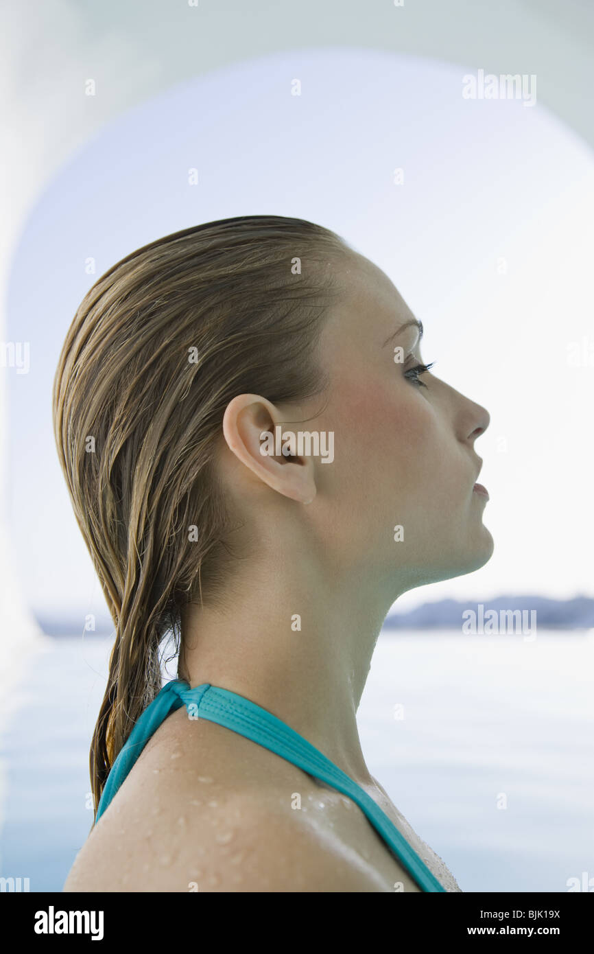 Profile of woman in bathing suit with wet hair Stock Photo - Alamy