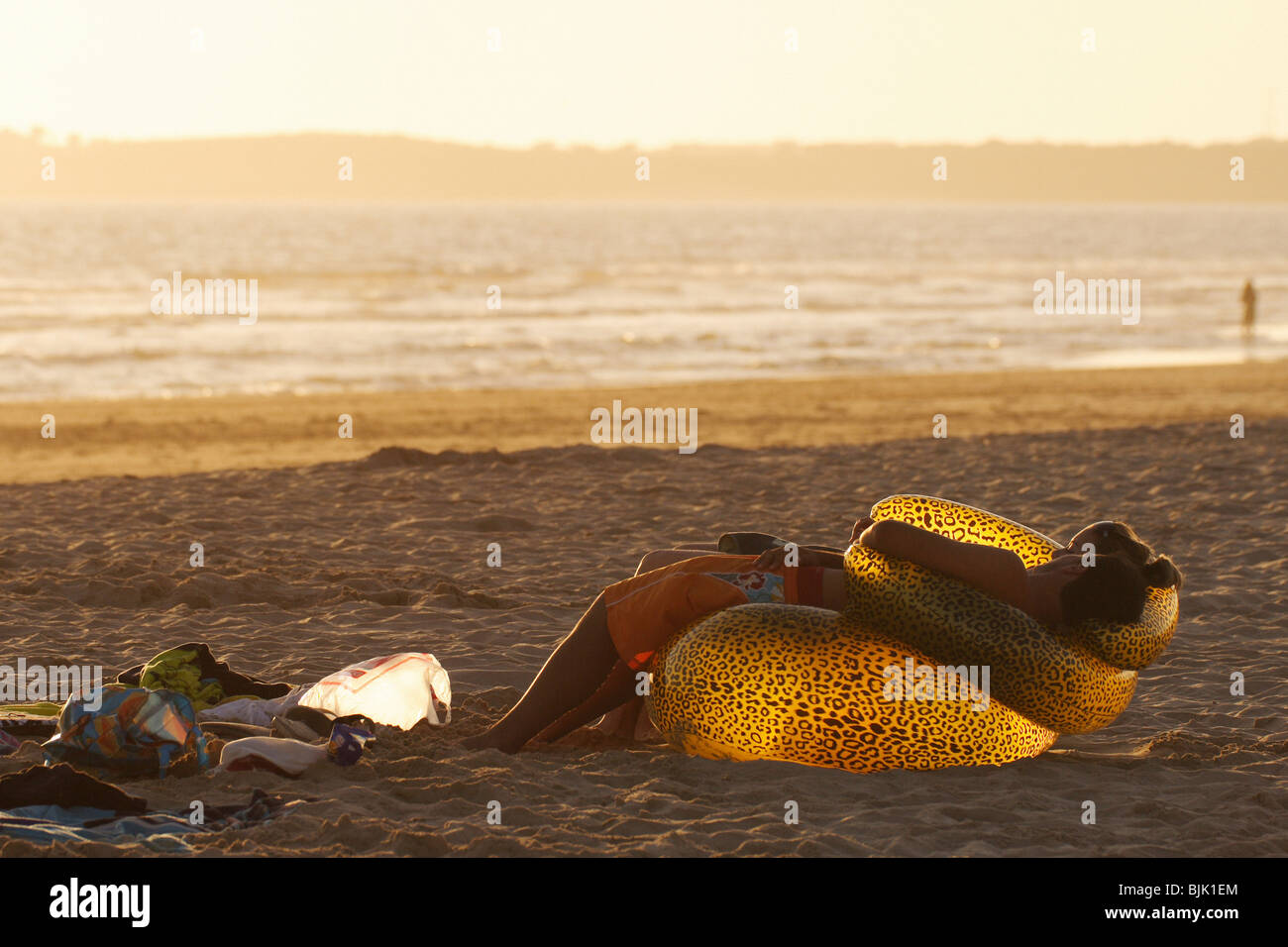 People sunbathing on a beach Stock Photo - Alamy