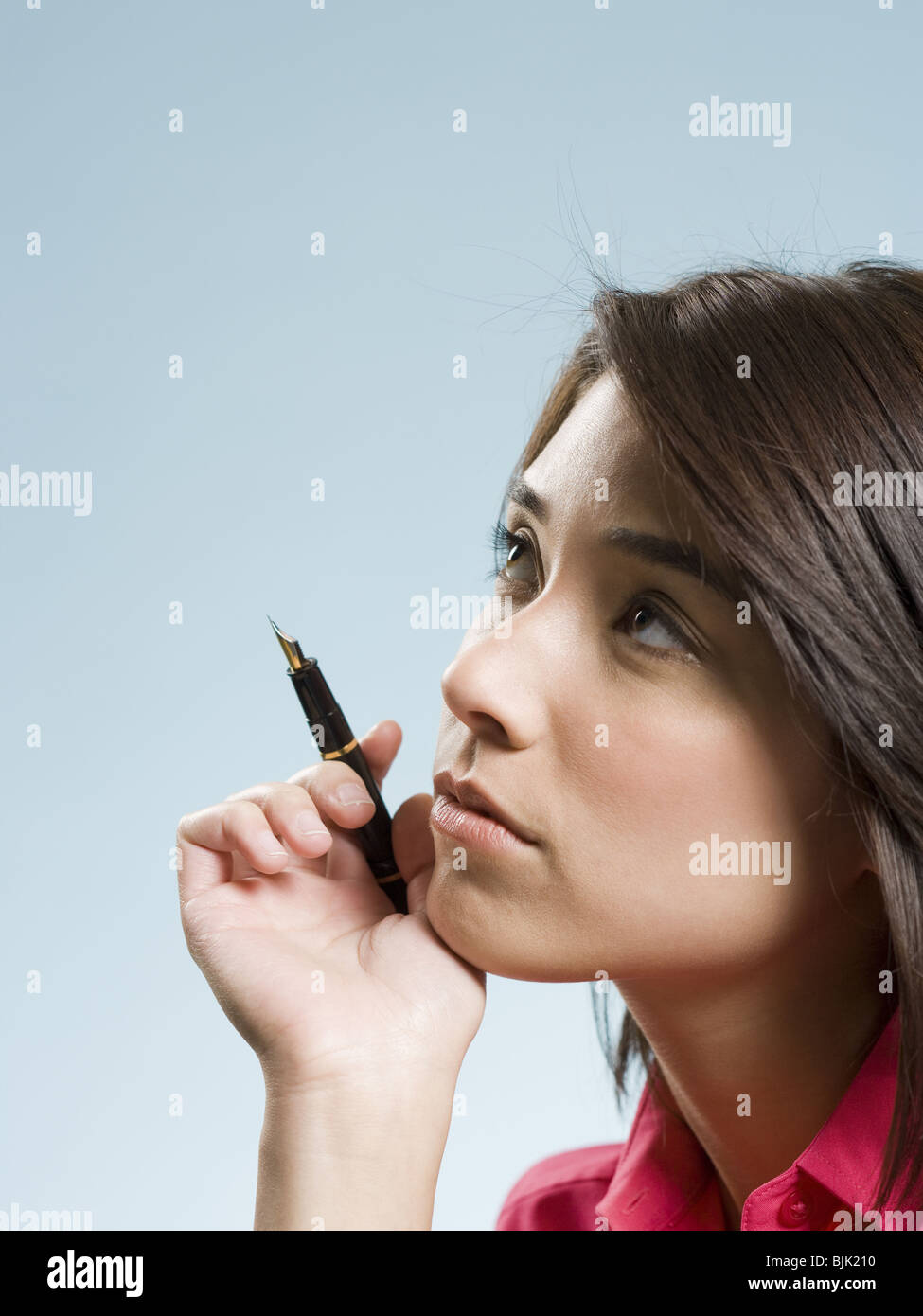 Girl with fountain pen smiling Stock Photo - Alamy